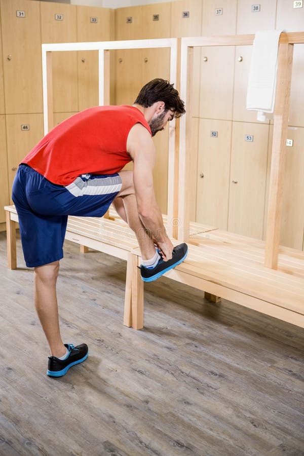 Man Tying Shoelace in Locker Room Stock Image - Image of attractive ...