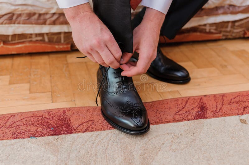 Man Tying Shoelaces on Black Leather Shoes Stock Photo - Image of groom ...
