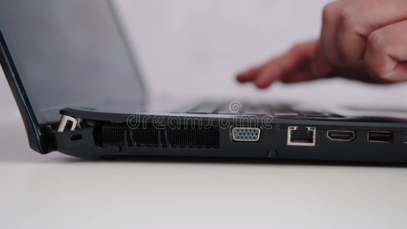 A Man Types on the Keyboard of a Broken Laptop. Broken Laptop Case ...