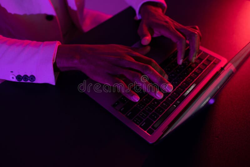 A Man Types Text on the Keyboard. Working at the Computer at Night ...
