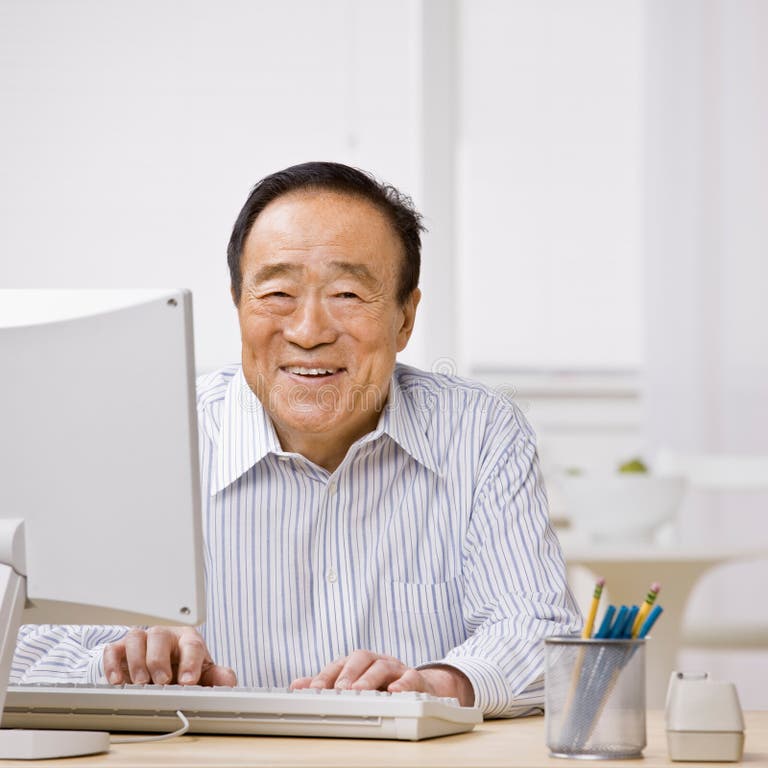 Man typing on computer stock photo. Image of confident - 6600178