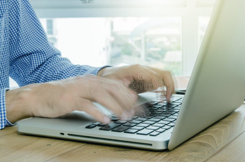 Man Typing on Computer Laptop in Blurred Motion. Stock Photo - Image of ...