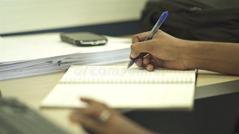 Man Typing on Keyboard and Taking Notes - Close Up Stock Footage ...