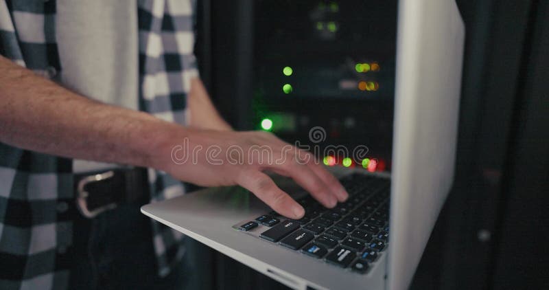 Man Typing on Laptop in Server Room Stock Footage - Video of browsing ...