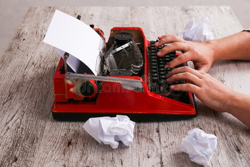 The Man is Typing and Next To the Crumpled Sheets of Paper. Stock Image ...