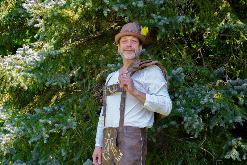 A Man in a Tyrolean Folk Costume Enjoying Nature with a Proud Posture ...