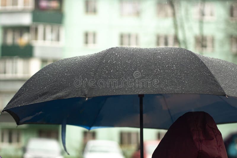Man with an Umbrella from the Rain. Rainy Weather Outside Stock Photo ...
