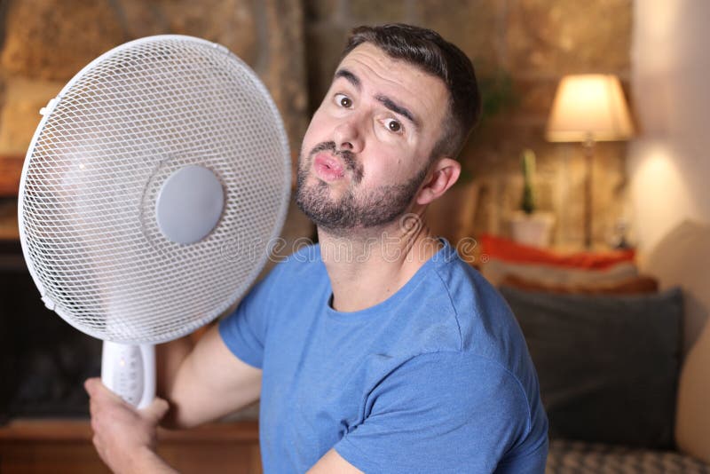 Man during Unbearable Heatwave Using Electric Fan Stock Image - Image ...