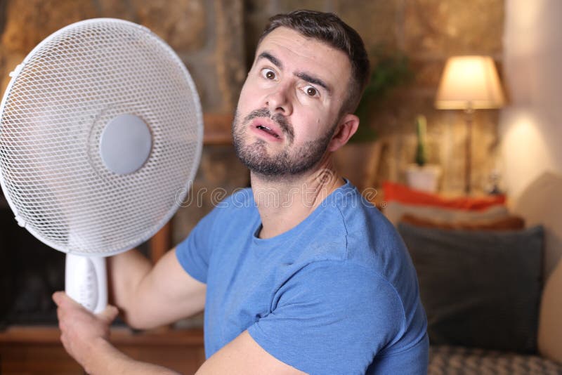Man during Unbearable Heatwave Using Electric Fan Stock Photo - Image ...