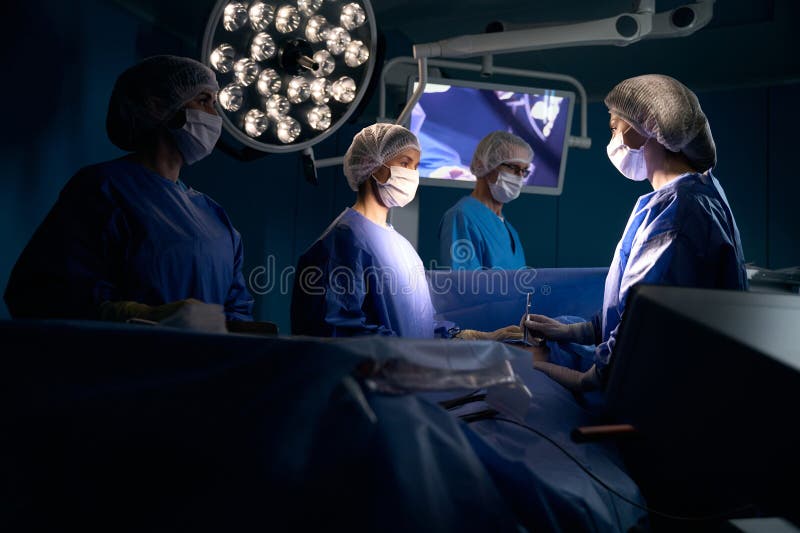 Man Under Anesthesia Lies on the Operating Table Stock Photo - Image of ...