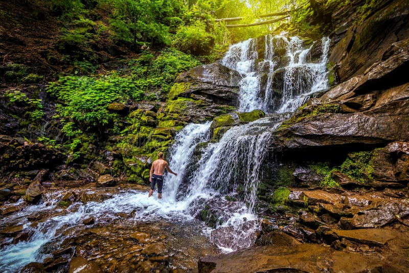 Man Under the Beautiful Waterfall in Wild Forest Stock Image - Image of ...