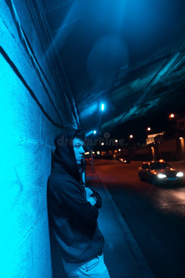Man under the bridge stock photo. Image of night, road - 95318380