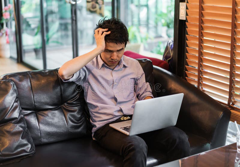 Man Under a Lot of Stress Using Laptop Computer in Cafe Stock Image ...