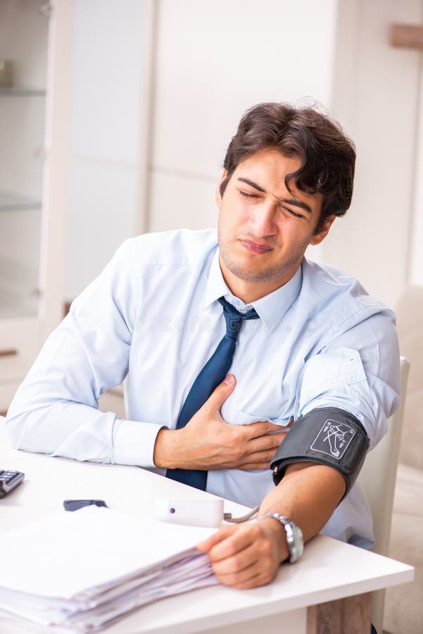 The Man Under Stress Measuring His Blood Pressure Stock Photo - Image ...