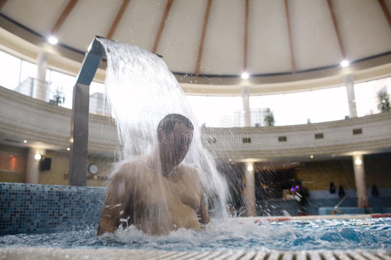 Man Under Water Stream in the Swimming Pool Stock Image - Image of ...