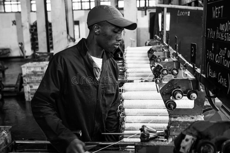 Man in Uniform Operating Machine in a Factory Editorial Image - Image ...