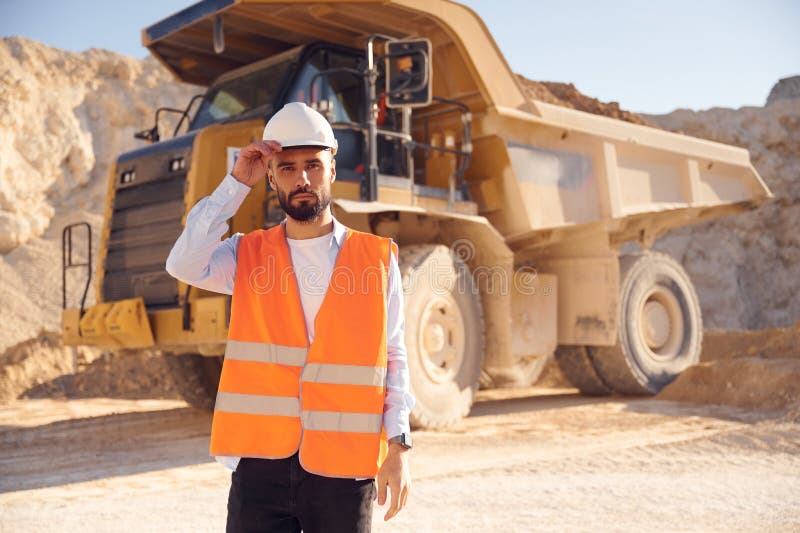 Man in Uniform is Working in the Quarry at Daytime Stock Photo - Image ...
