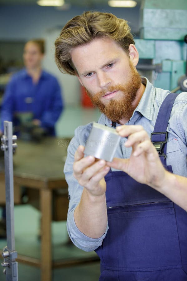 Man in Uniform Works on Production Industrial Modern Technology Stock ...