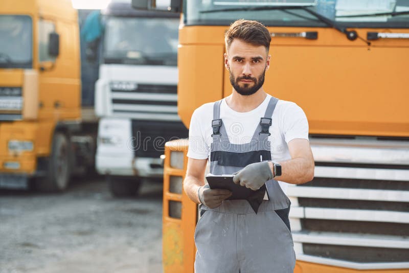 Man in Unifrom Doing Service for Big Truck Vehicle Stock Photo - Image ...