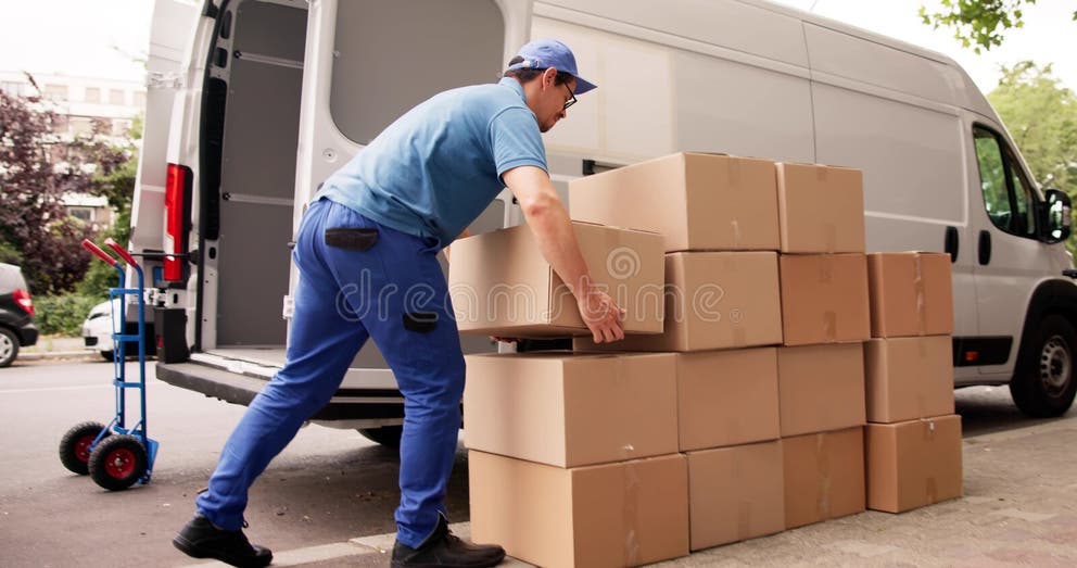 Man Unloading Boxes from Van for Removal Stock Photo - Image of smile ...