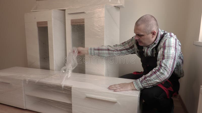 Man unpack furniture stock video. Video of preparation - 91842465