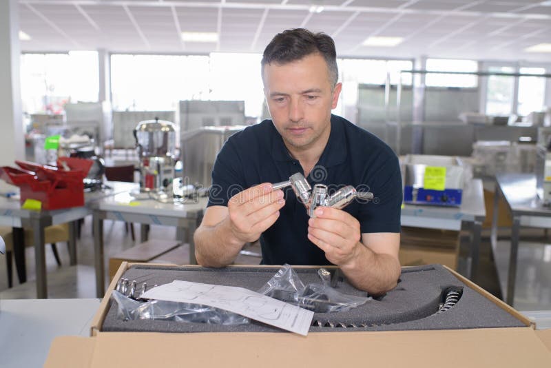 Man Unpacking Items from Box Stock Photo - Image of open, competent ...