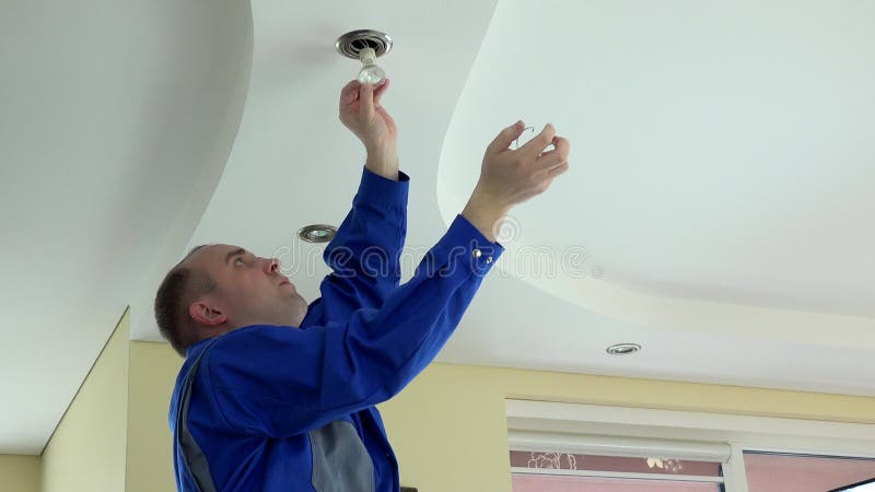 Man Unscrew Halogen Bulb for Replacing Stock Video - Video of ...