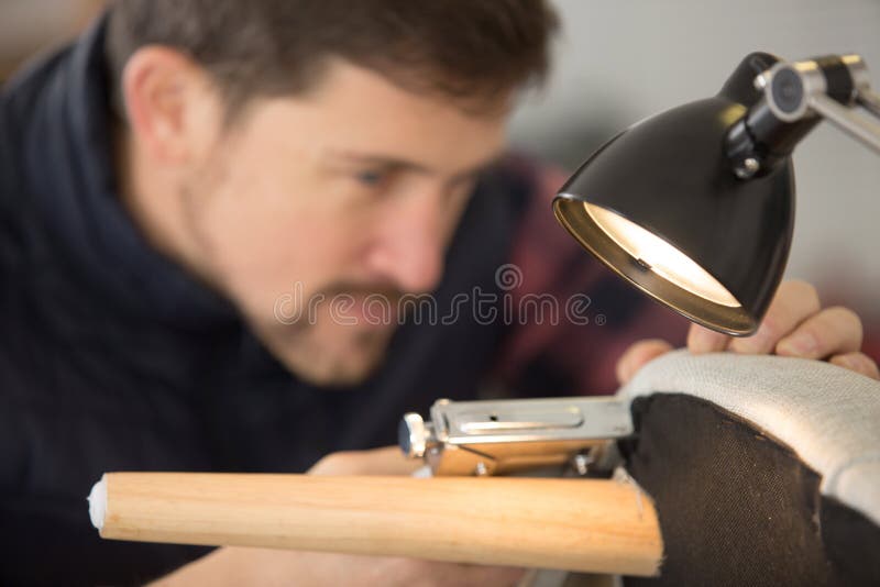 Man Upholsterer Using Staple Gun on Chair Stock Photo - Image of tool ...