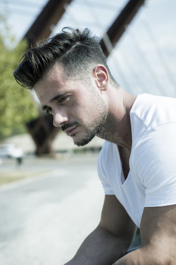 Man in Urban Setting in Front of Big Metal Structure Stock Image ...