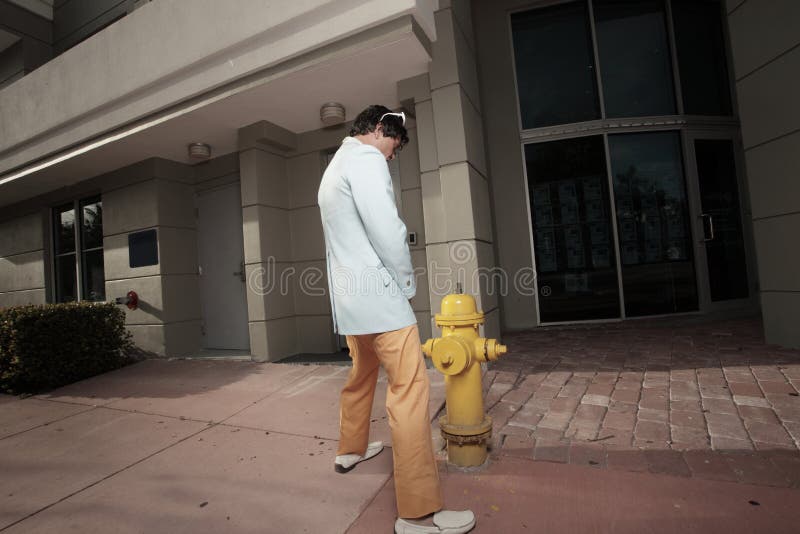 Man Urinating on a Fire Hydrant Stock Image - Image of fashion, strange ...