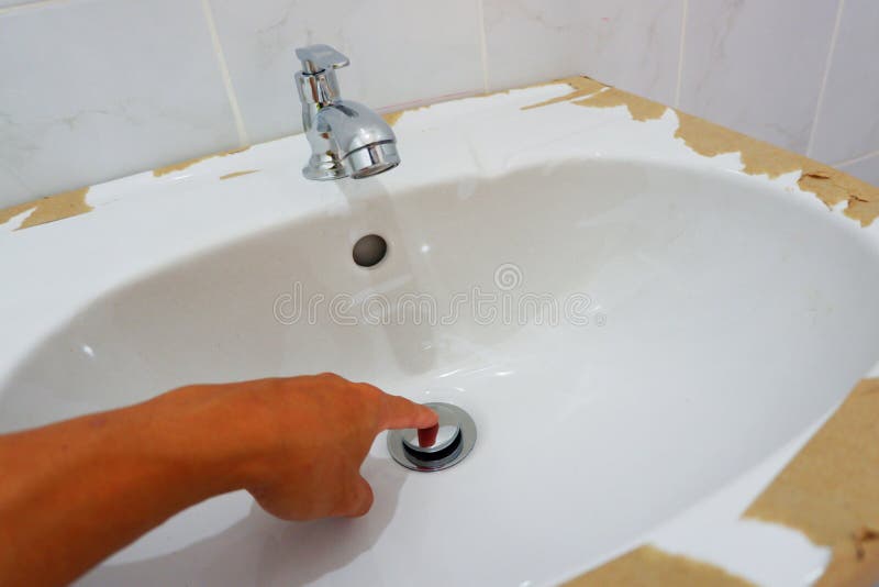 Man is Use Hand To Press Button Drain Water in Basin Stock Image ...