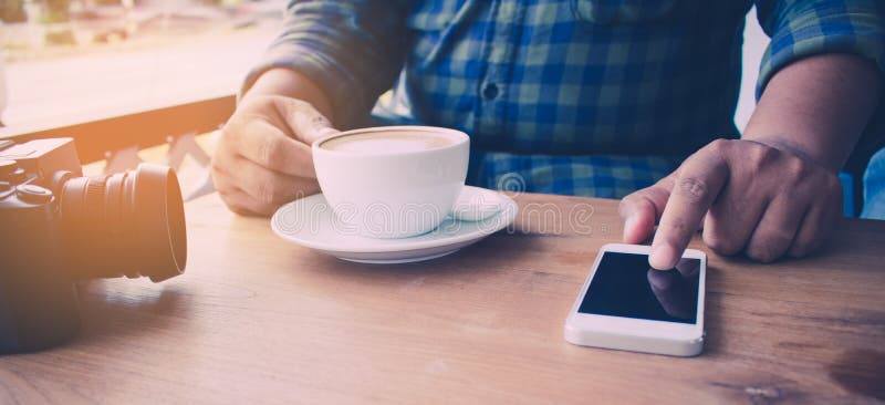 Man Use Mobile Phone and Holding Coffee Cup Vintage Tone. Stock Image ...