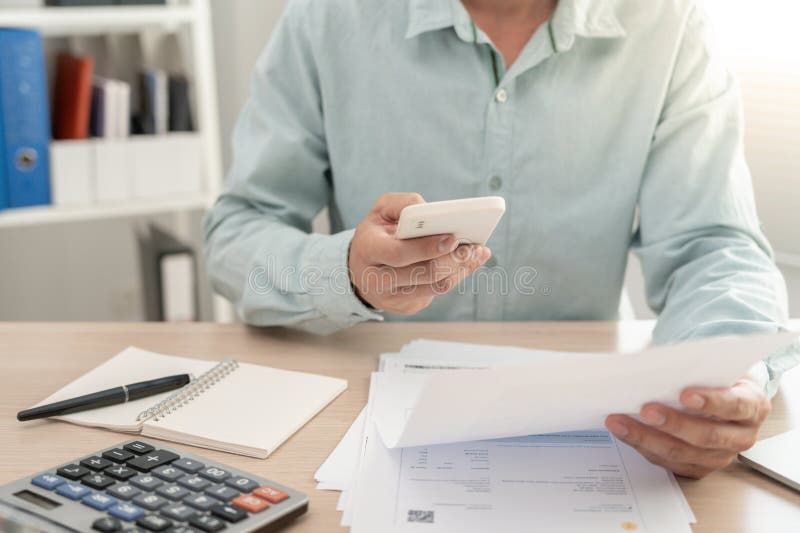 Man Use Phone To Scan Barcode or QR Codes To Pay Credit Card Bill after ... Man Use Phone To Scan Barcode or QR Codes To Pay Credit Card Bill after ...