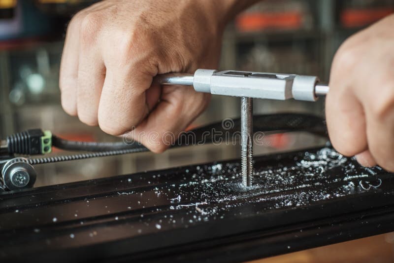Men Making Ice-hole, Cleaning it from Ice Pieces Using Crowbar Stock ...