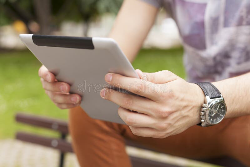 Man Use Tablet Reading News and Communicate on Social Networks Stock ...