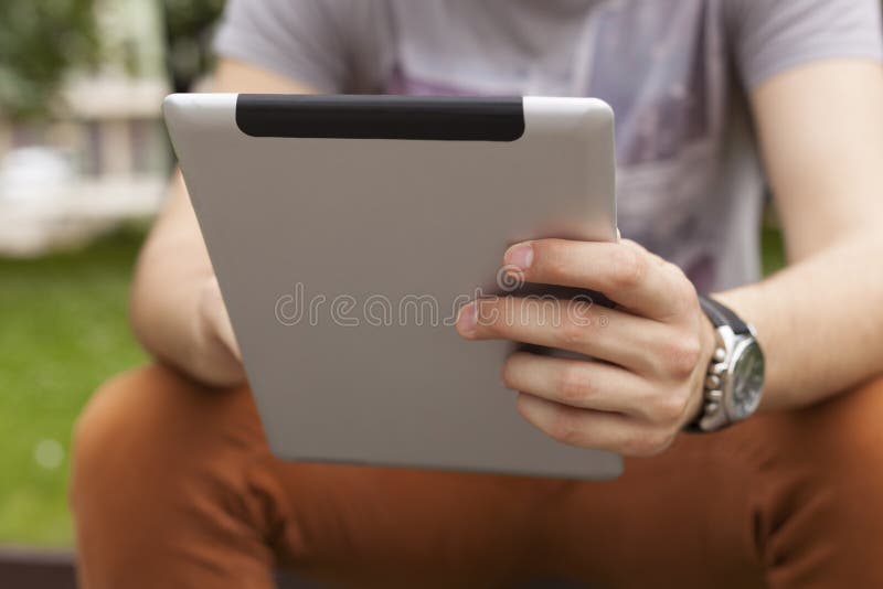 Man Use Tablet Reading News and Communicate on Social Networks Stock ...