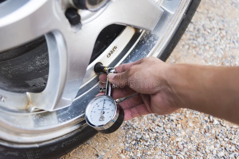 Use TIRE GAUGE for Check Tire Pressure before Use the Car Stock Image ...