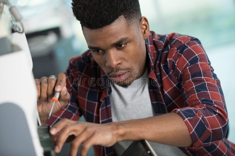Man Uses Screwdriver To Fix Printer Stock Image - Image of electronic ...