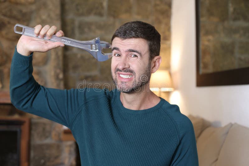 Man Using Adjustable Wrench To Fix His Mind Stock Photo - Image of ...