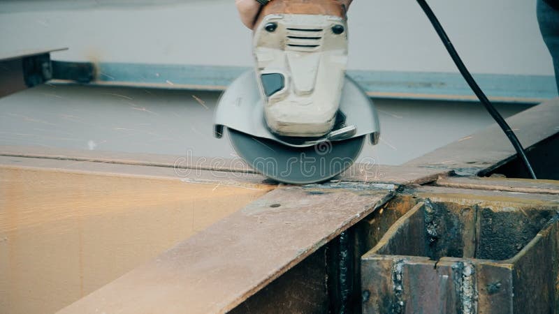 Man Using Angle Disc Grinder, Sparks while Grinding Iron Stock Footage ...