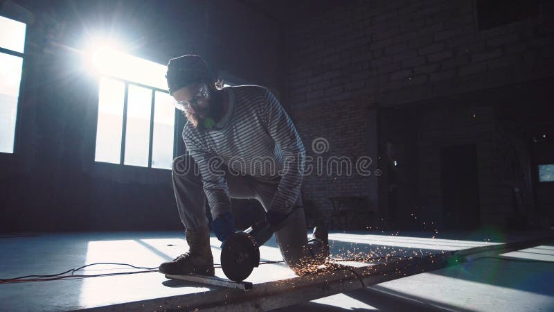 Man using angle grinder stock photo. Image of cutting - 102301012