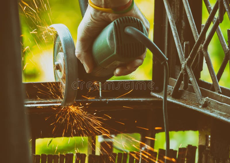 Man using angle grinder stock photo. Image of laborer - 147814734