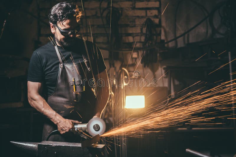 Man Using Angle Grinder in Factory and Throwing Sparks Stock Image ...