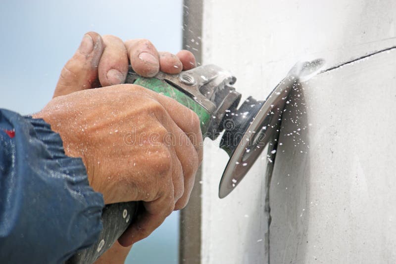 Man using an angle grinder stock photo. Image of hand - 241220636