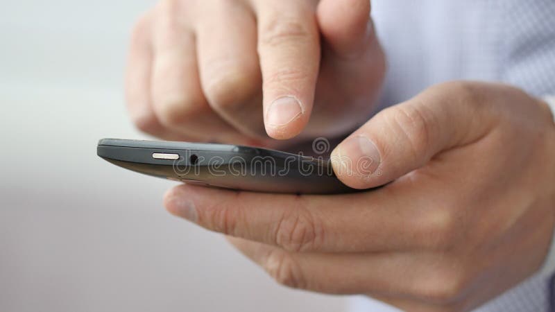 A Man Using Apps on a Mobile Touchscreen Smartphone Stock Photo - Image ...