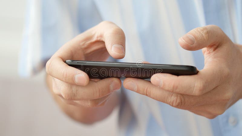 A Man Using Apps on a Mobile Touchscreen Smartphone Stock Photo - Image ...