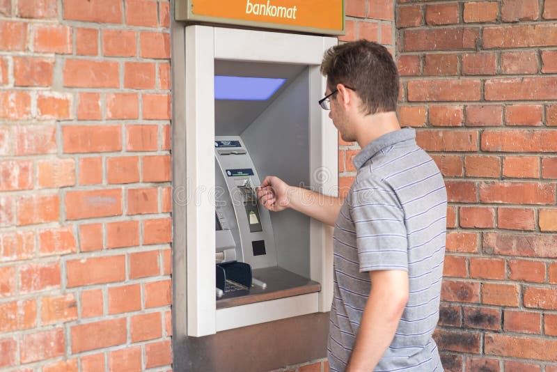 Man using ATM bank machine stock image. Image of deposit - 98132531