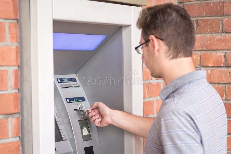 Man using ATM bank machine stock image. Image of closeup - 98132679