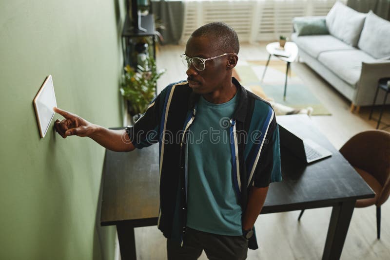 Man Using Automated Home System Stock Image - Image of electronics ...