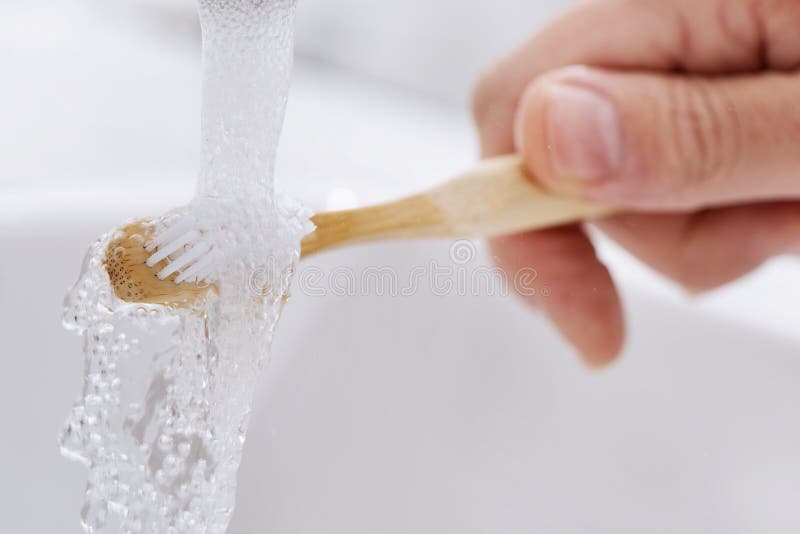 Man Using a Bamboo Toothbrush in the Bathroom Stock Photo - Image of ...